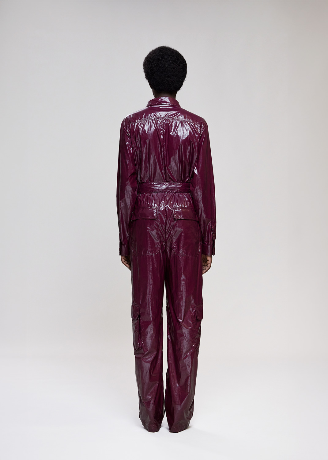 LUXURIOUS WORKERS JUMPSUIT IN TECHNICAL LAQUERED NYLON WITH MULTIPLE